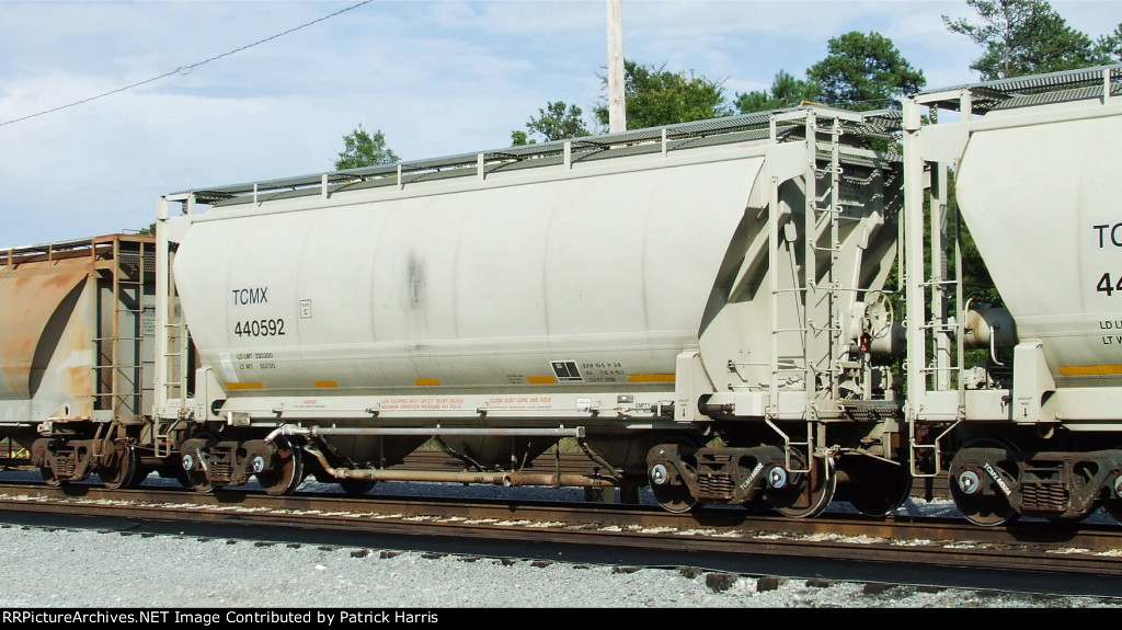TCMX 440592 3230cf pressure differential covered hopper in the CSX Wyvern Yard in Cartersville ...